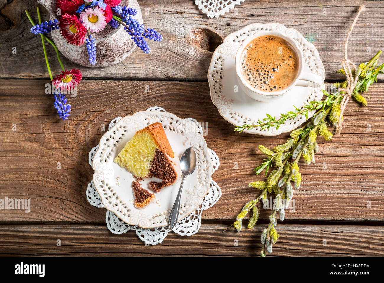 Cup of coffee, easter cake and spring flowers Stock Photo - Alamy
