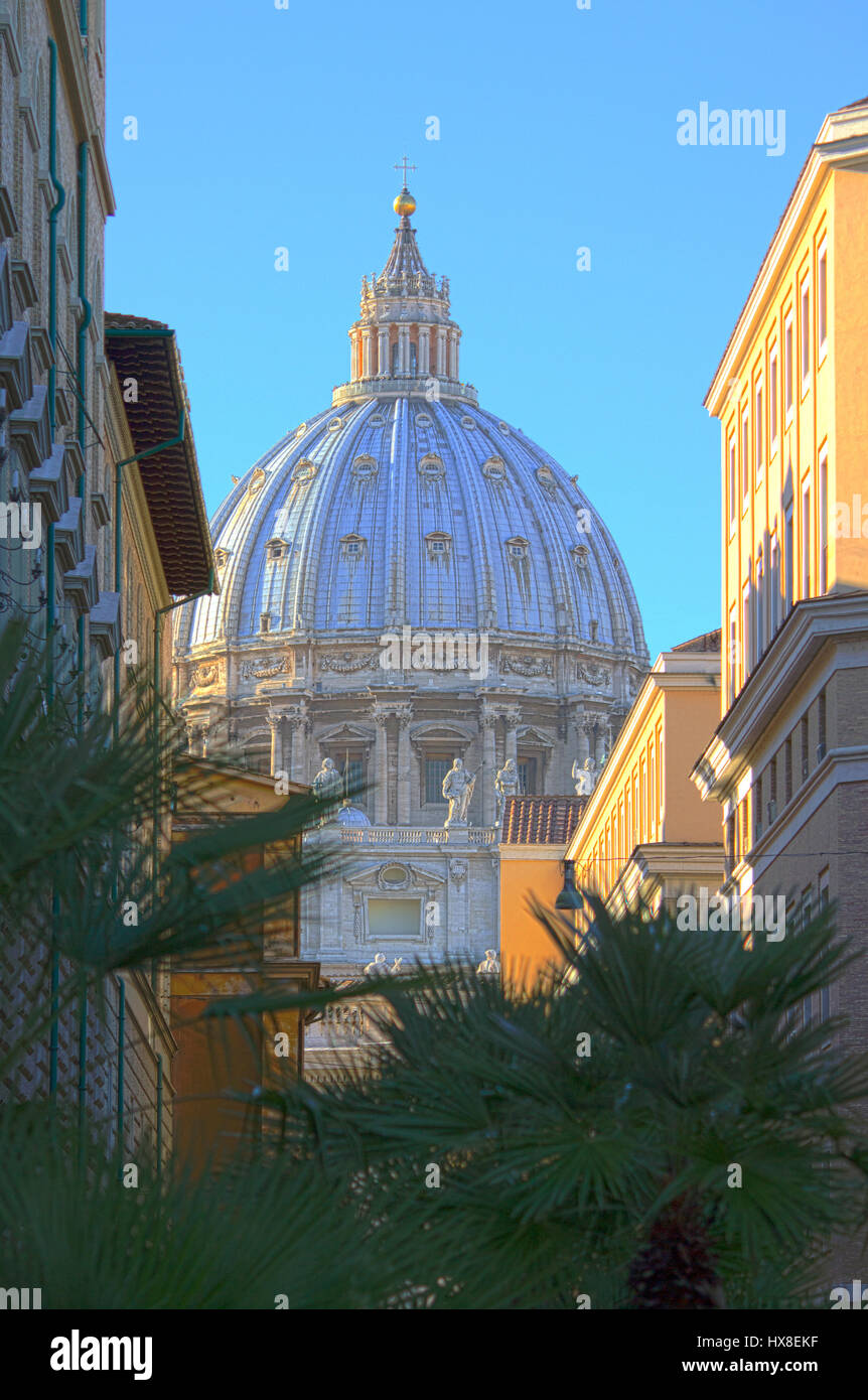 A view of the famous St Peter dome, shot from a street in Rome, Italy ...
