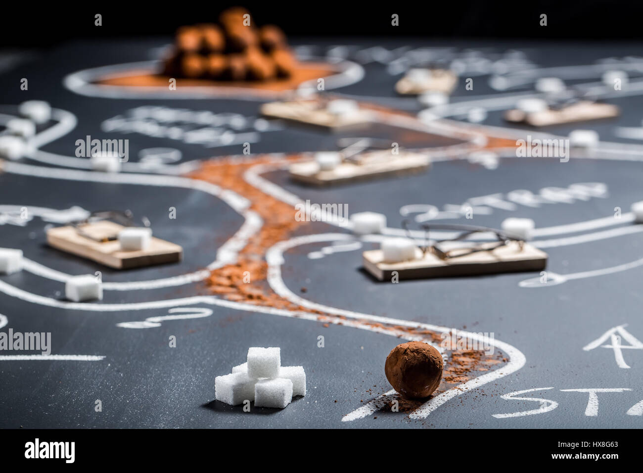 Difficult labyrinth to find the sweet treasure Stock Photo - Alamy