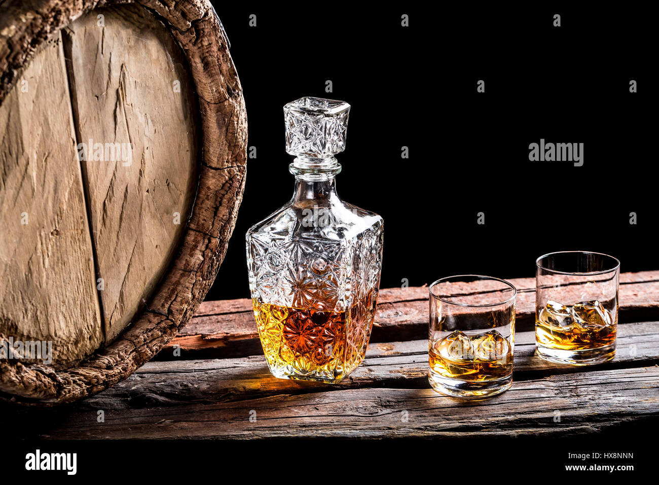 Two glasses of aged whisky and old barrel Stock Photo - Alamy