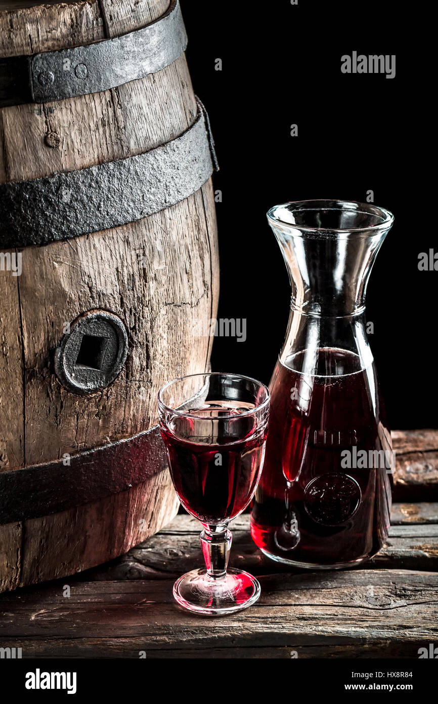 Glass of Red wine in the old wine cellar Stock Photo - Alamy