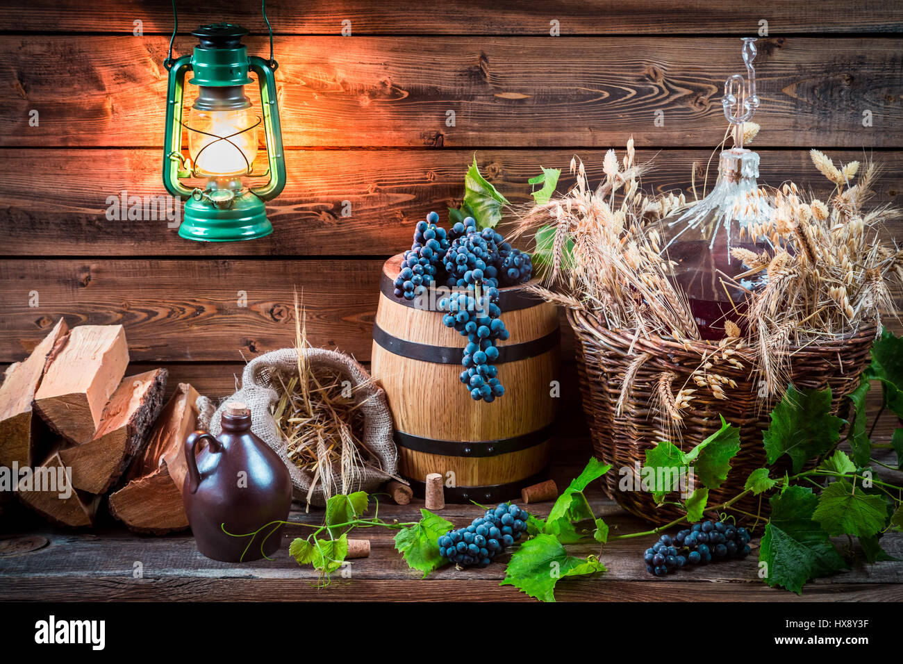 Grapes and red wine in a demijohn Stock Photo - Alamy