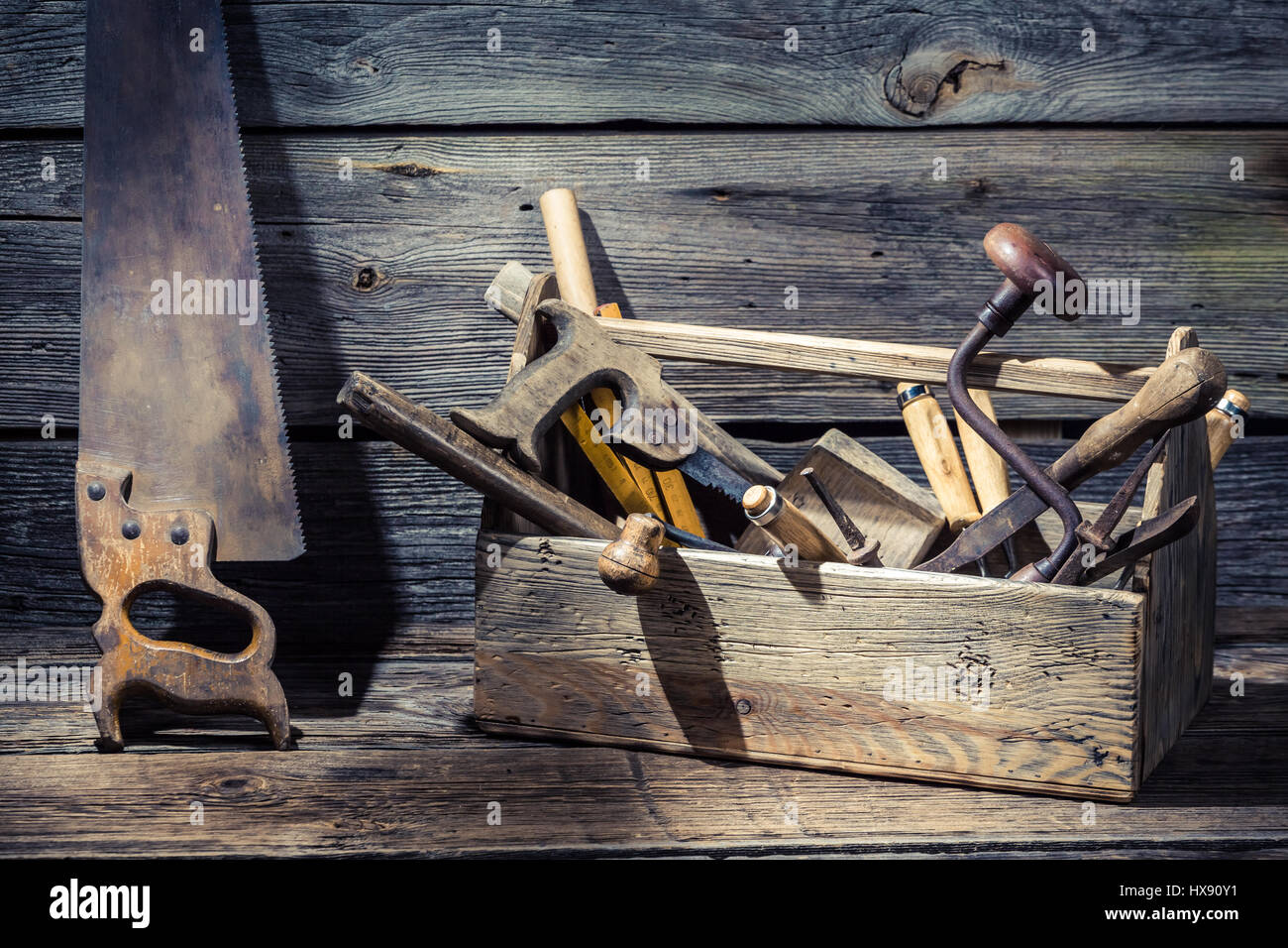 Old carpenters box with tools on old wooden table Stock Photo - Alamy