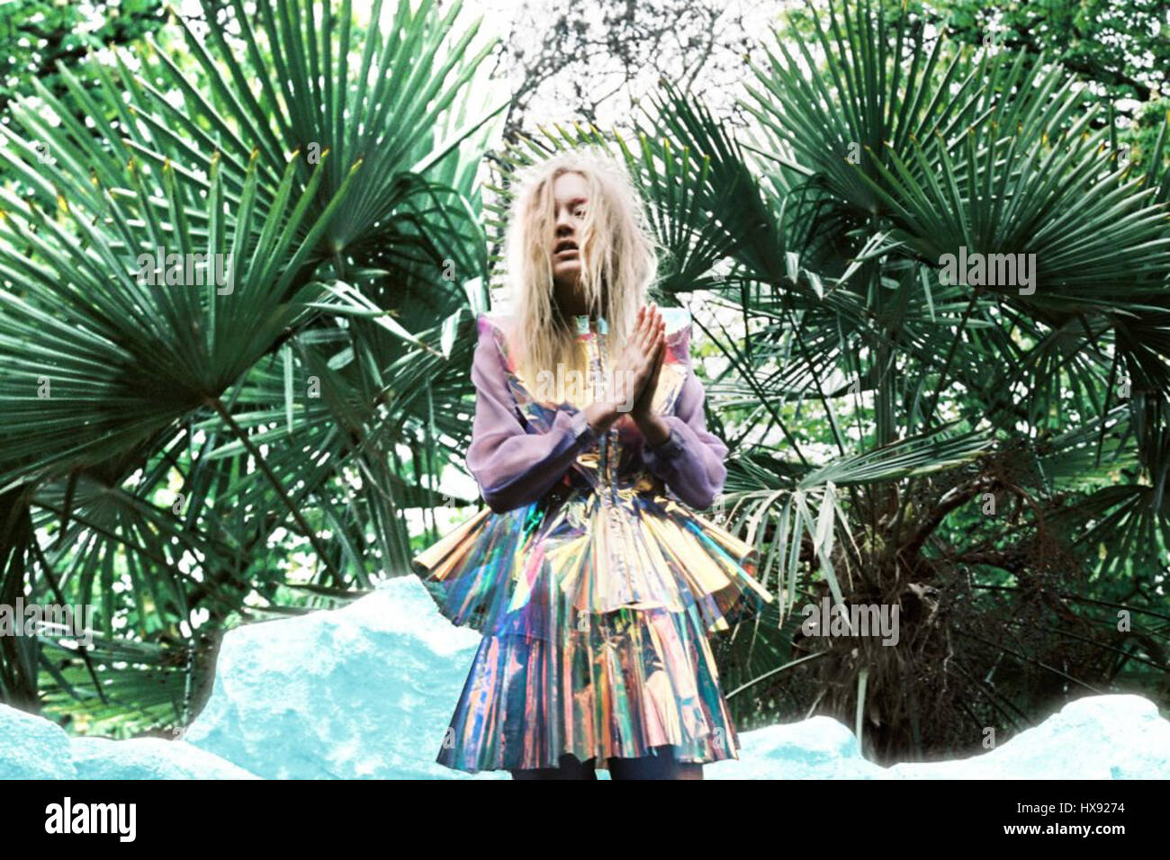 This Vogue magazine cover features a high-fashion depiction of ...