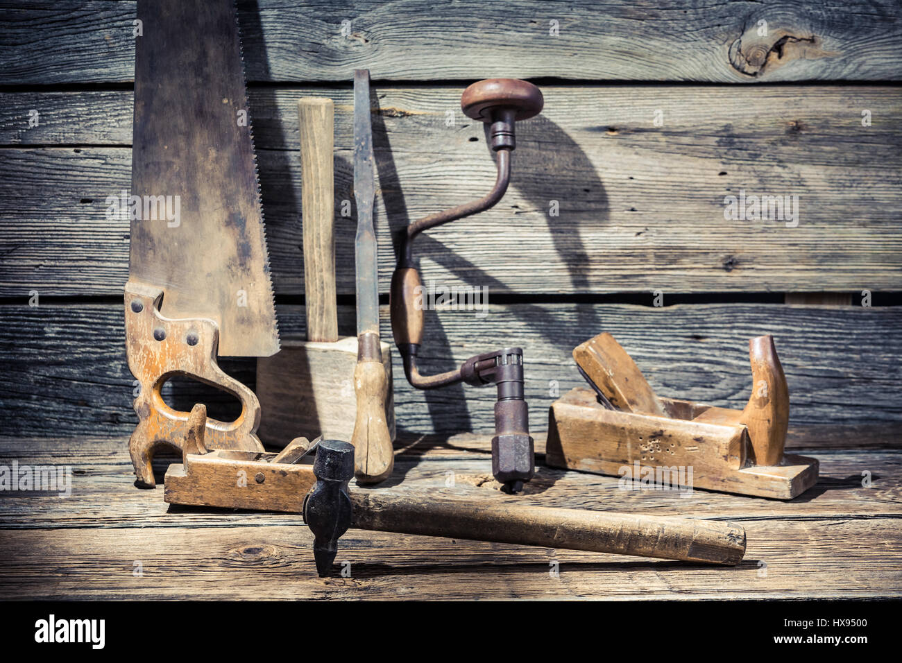 Hammer, saw and chisel on carpentry workbench Stock Photo - Alamy