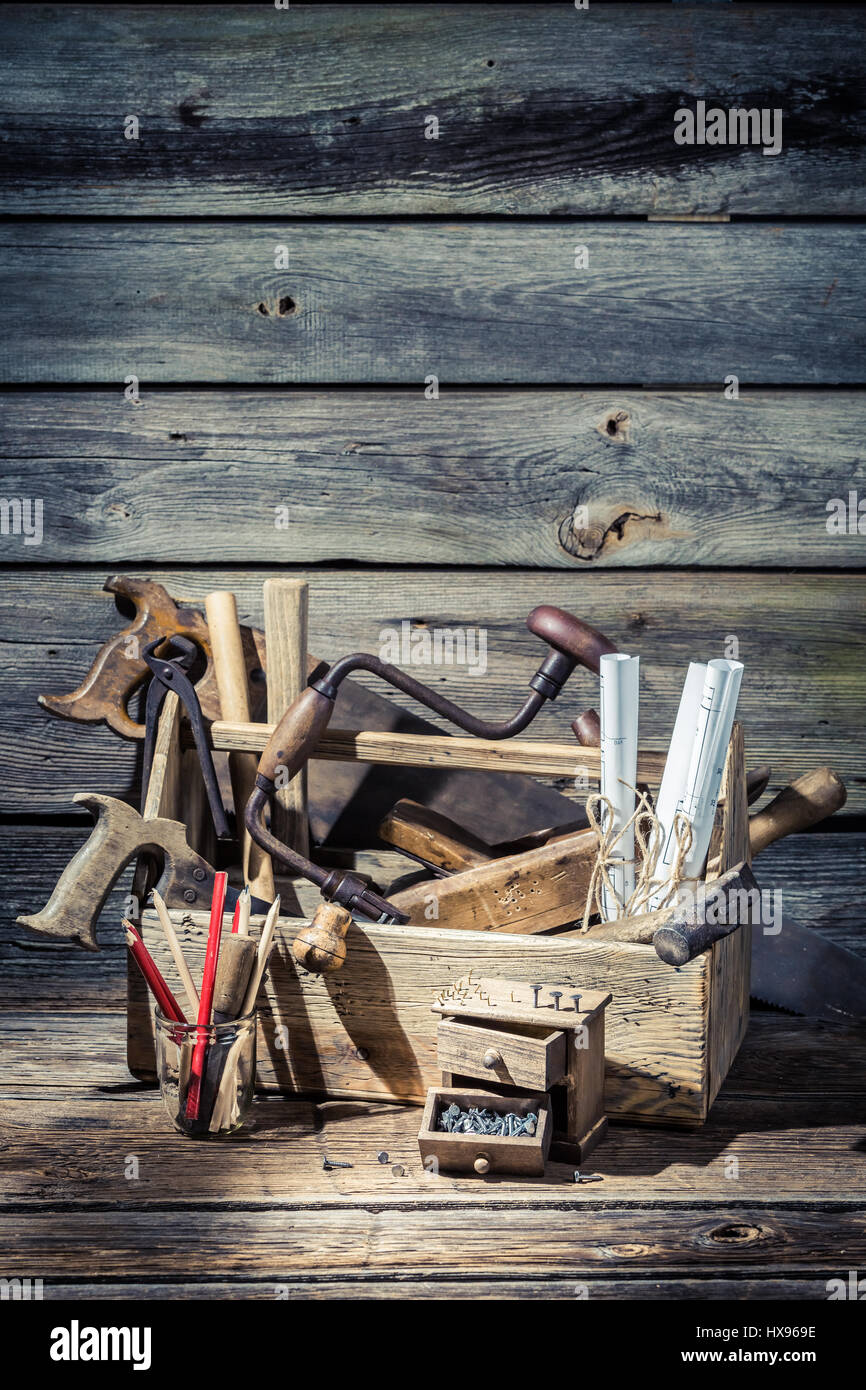 Diagrams and carpentry tools in a old workshop Stock Photo - Alamy