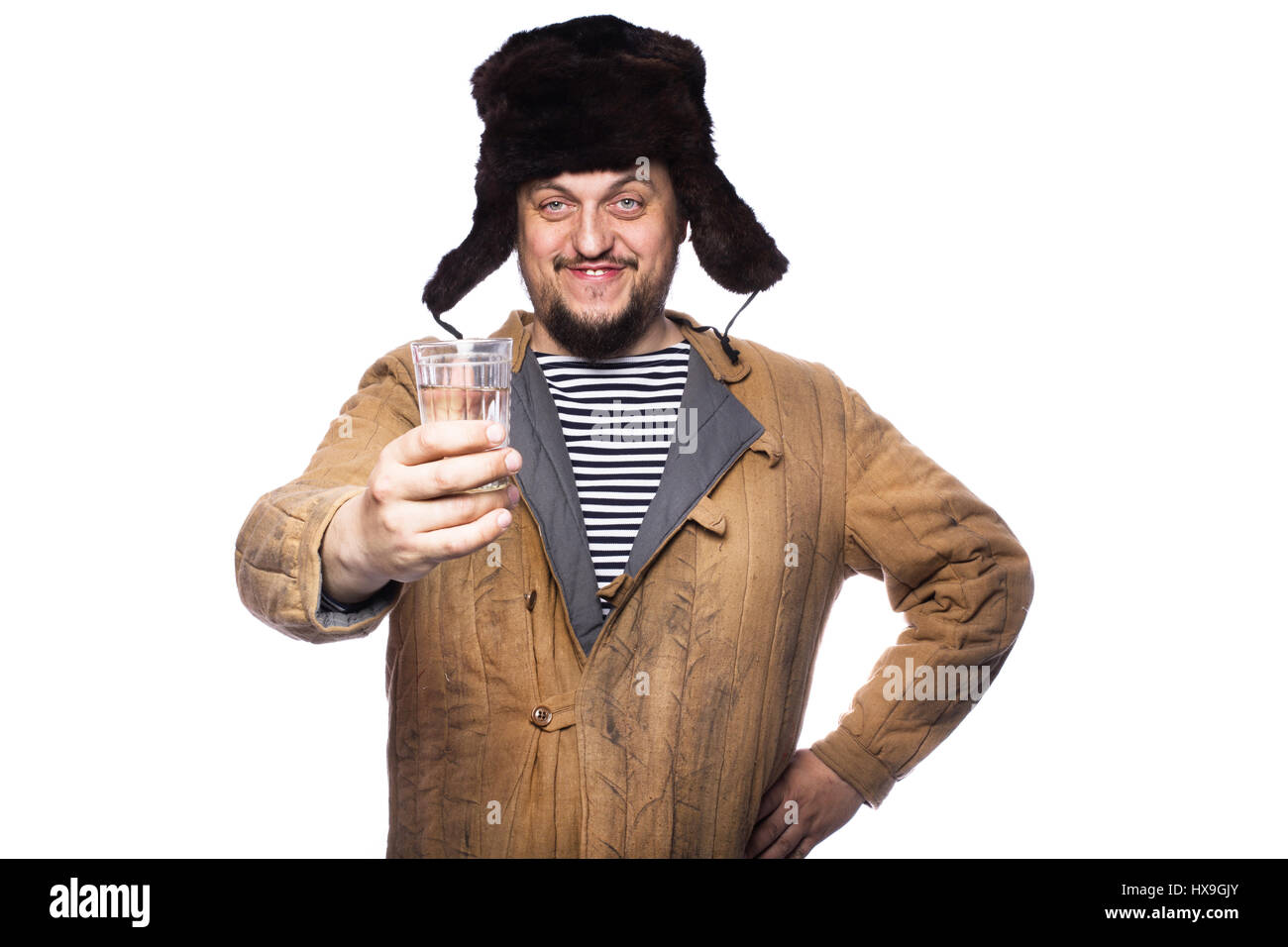 Happy russian man drink a vodka, cheers. Studio portrait isolated on ...
