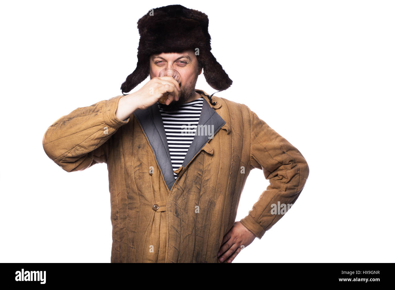 Happy russian man drink a vodka, cheers. Studio portrait isolated on ...