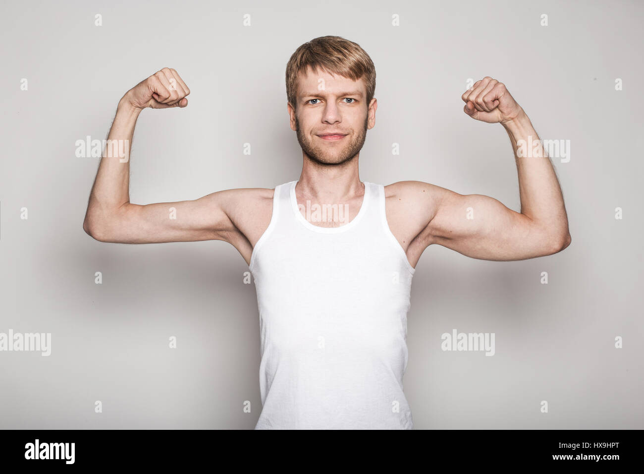Conceptual portrait of a left handed man Stock Photo - Alamy