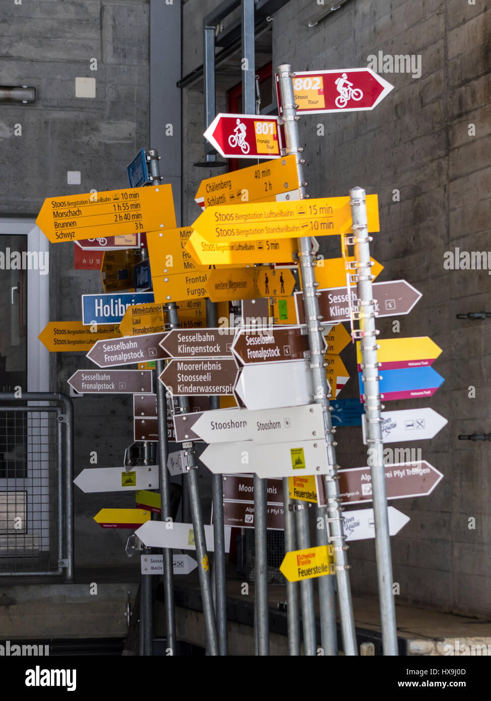 Many Swiss hiking signposts with overlapping signs stored for later ...