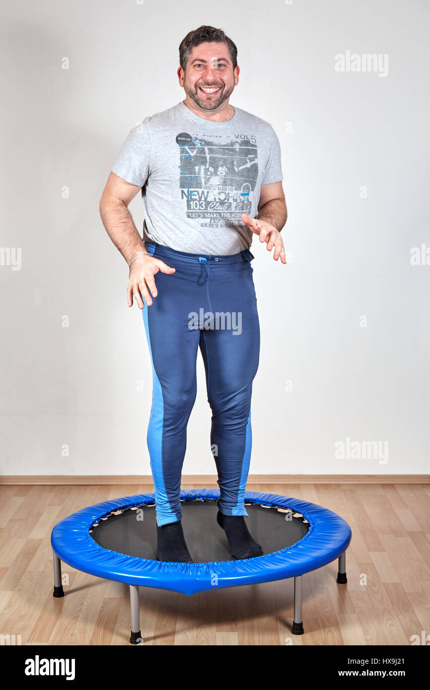 Man doing fitness for healthy lifestyle jumping on trampoline Stock ...
