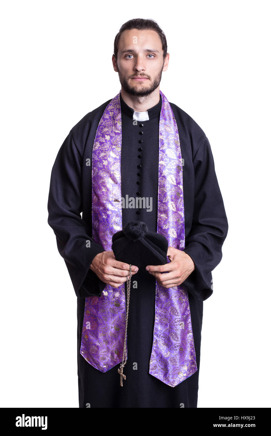Portrait of young priest. Studio portrait isolated on white background ...