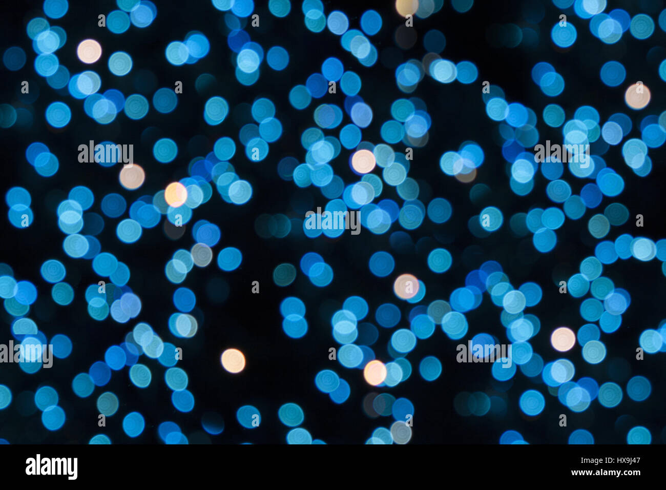 Irregular blue blurred ligts on a black background Stock Photo - Alamy