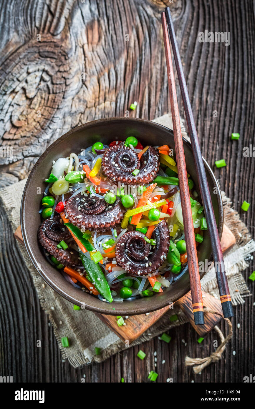 Traditional asian dish with octopus and noodles Stock Photo - Alamy