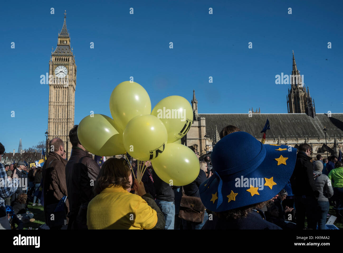 Protestors and a member of the Liberal Democrats Party standing on ...