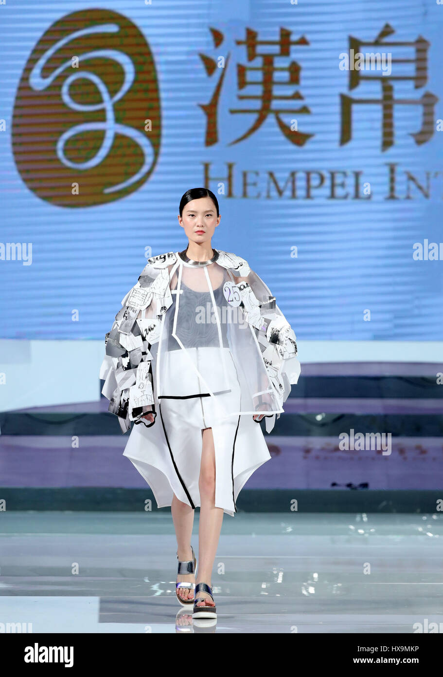 Beijing, China. 25th Mar, 2017. A model presents a creation of the ...