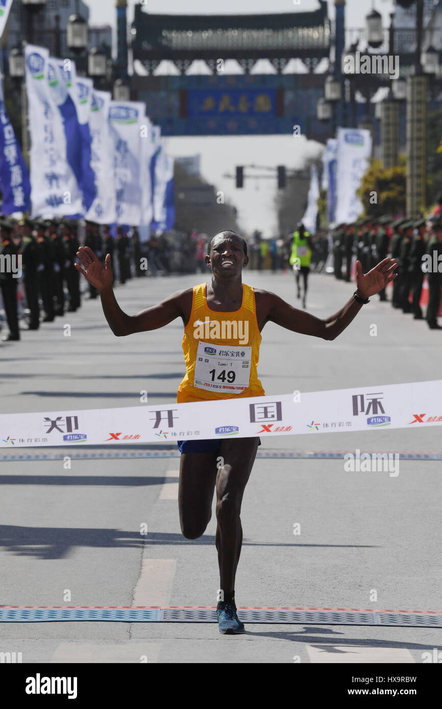 Kaifeng. 26th Mar, 2017. Titus Tuwei from Kenya sprints to the finish ...