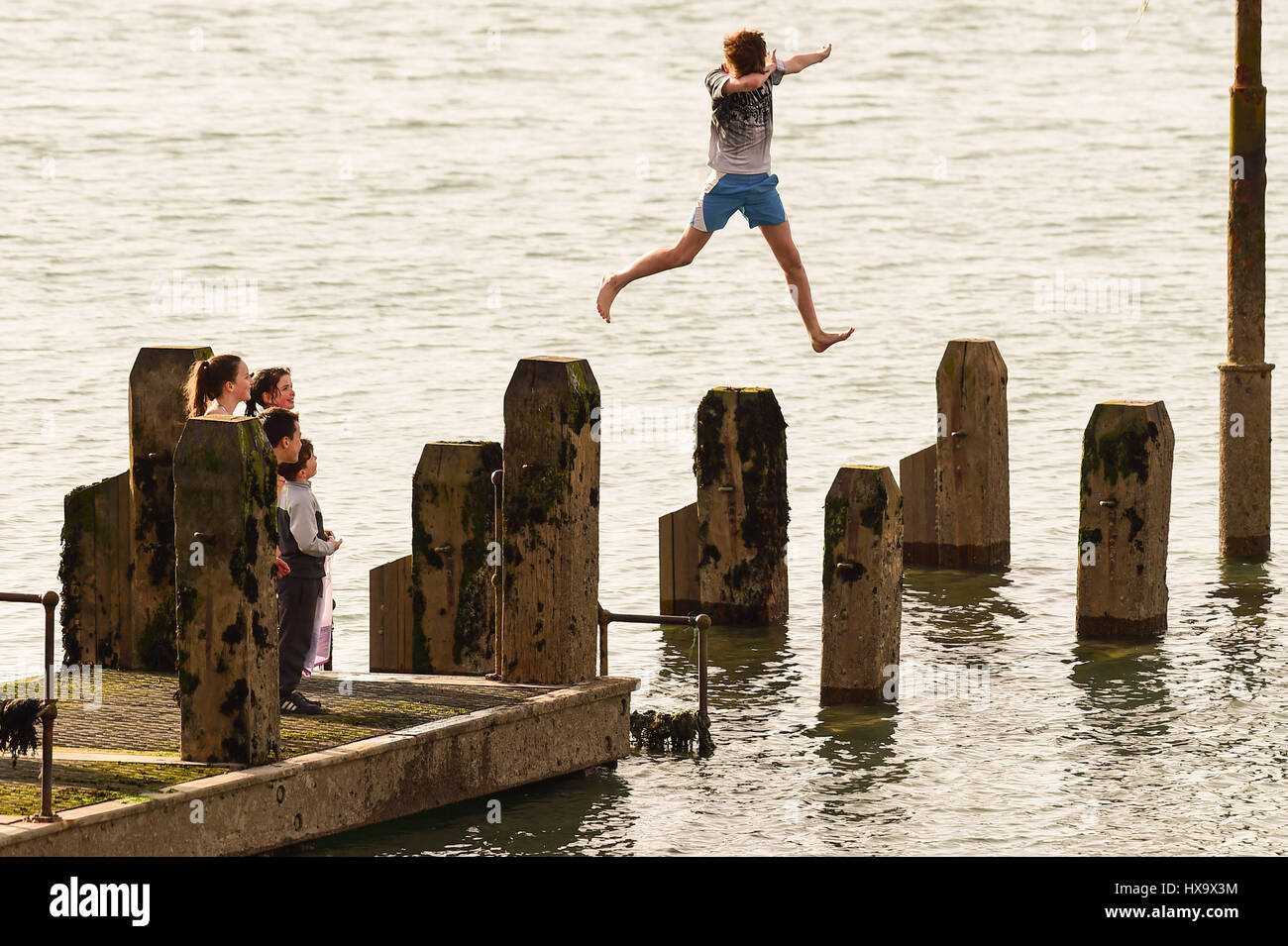 Child jumping off a pier hi-res stock photography and images - Alamy