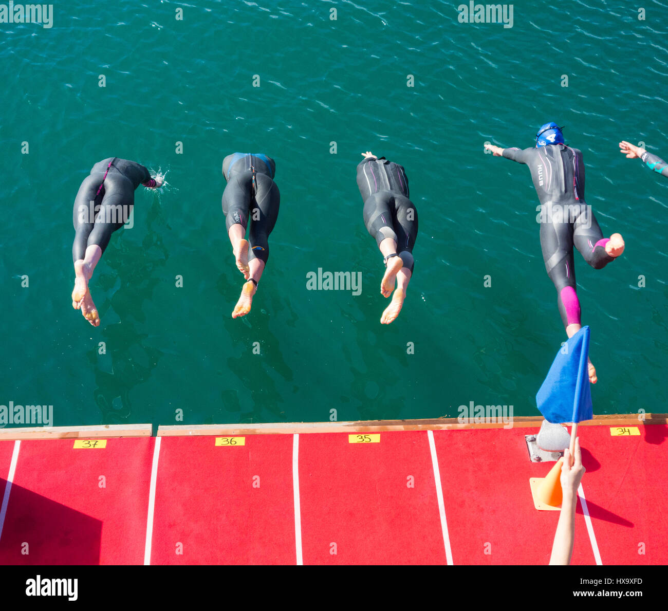 Triathletes at start of international triathlon Stock Photo - Alamy