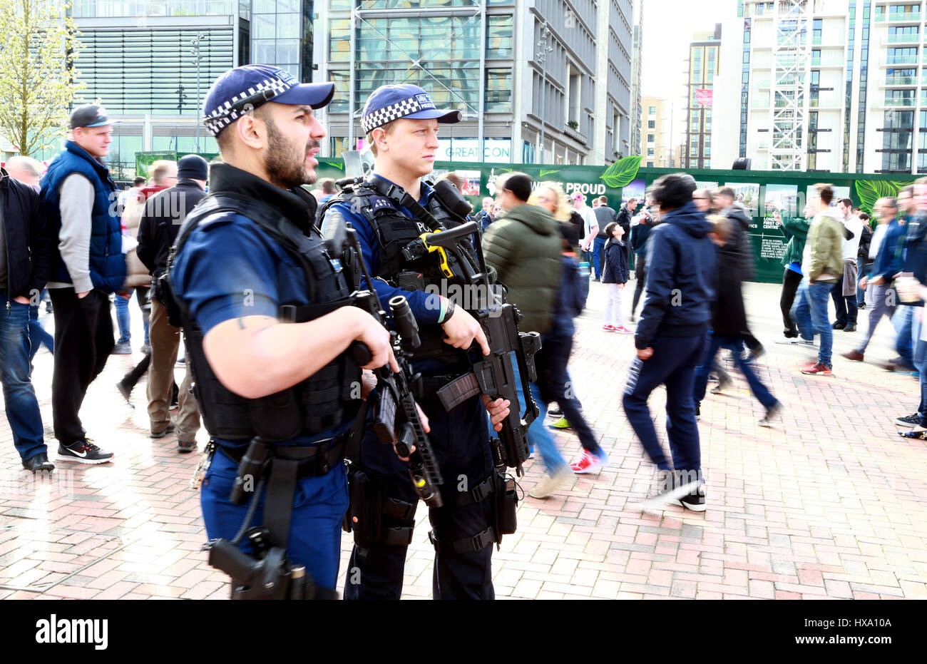 Wembley, UK. 26th Mar, 2017. Armed police patrol outside Wembley ...