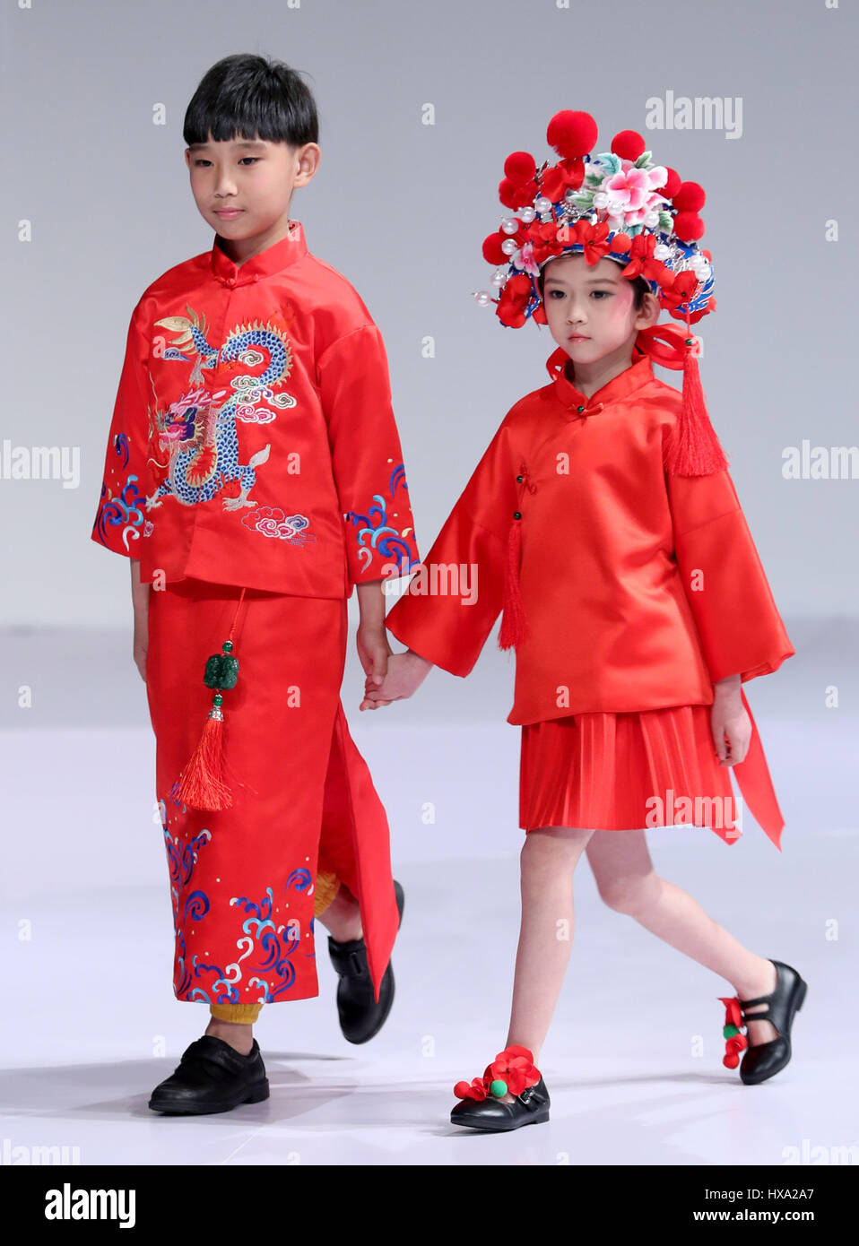 Beijing, China. 26th Mar, 2017. Young models walk the runway at the ...