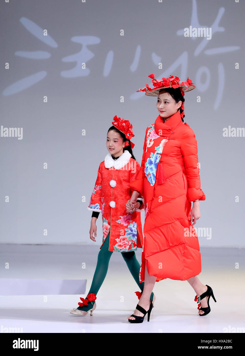 Beijing, China. 26th Mar, 2017. Models walk the runway at the ...