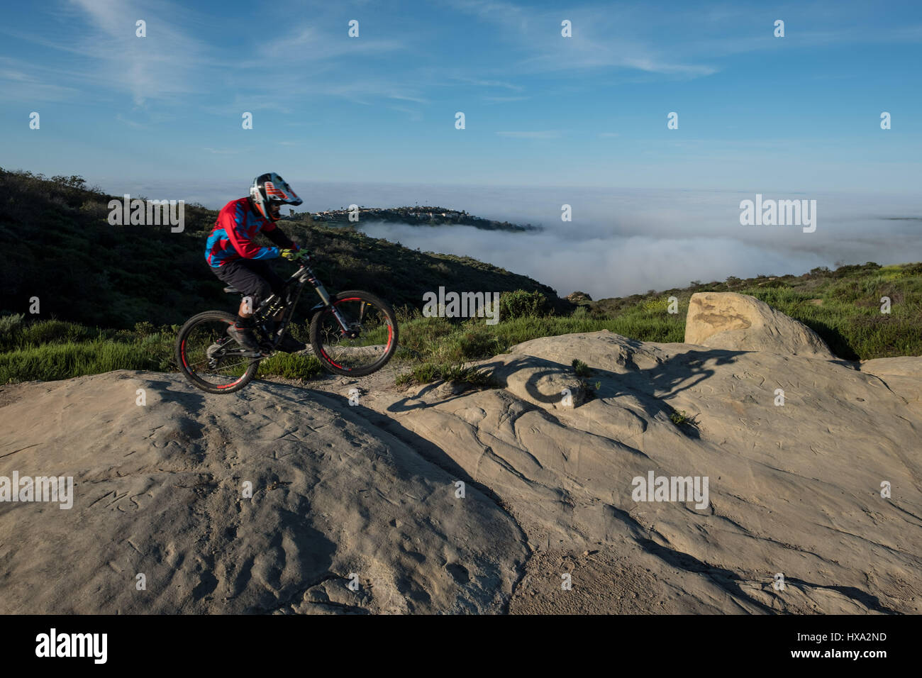 Laguna Beach, California, USA. 19th Mar, 2017. A mountain biker jumps ...