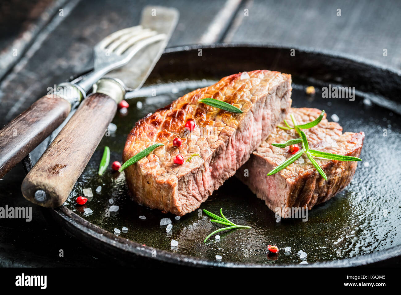 Hot roasted beef with fresh herbs ready to eat Stock Photo - Alamy