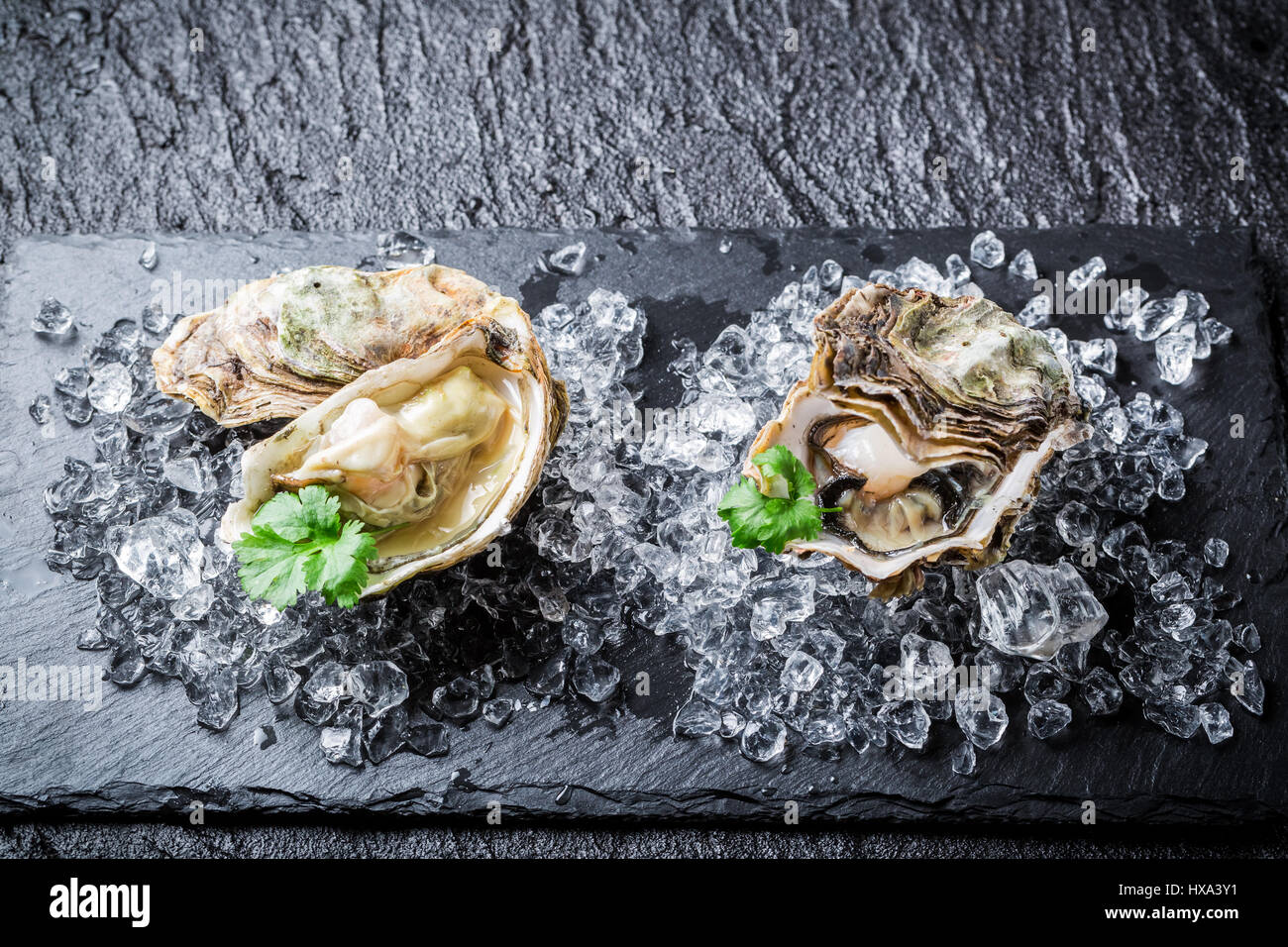 Delicious oyster in half shell hi-res stock photography and images - Alamy