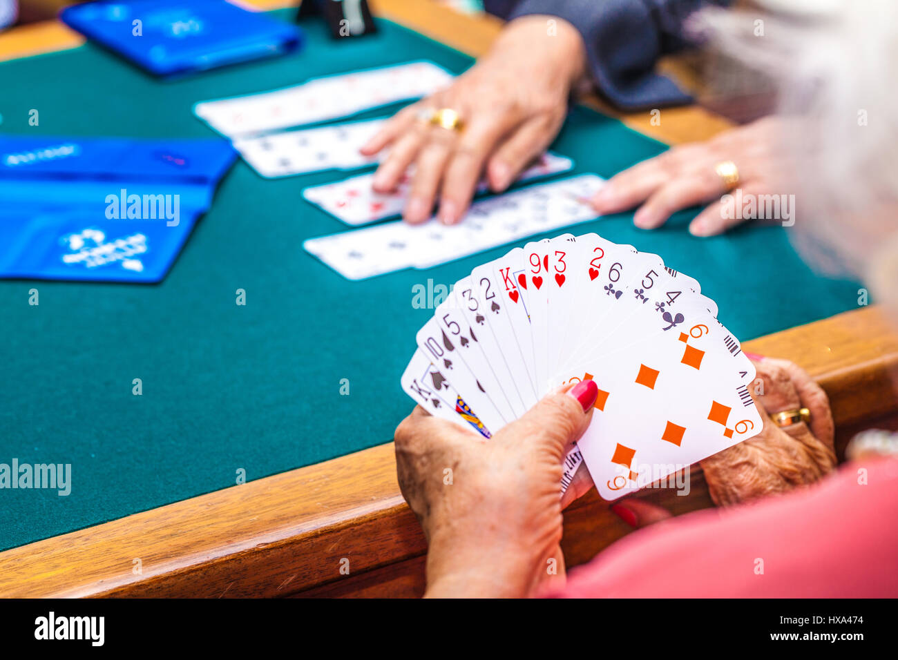 old people playing bridge game Stock Photo - Alamy