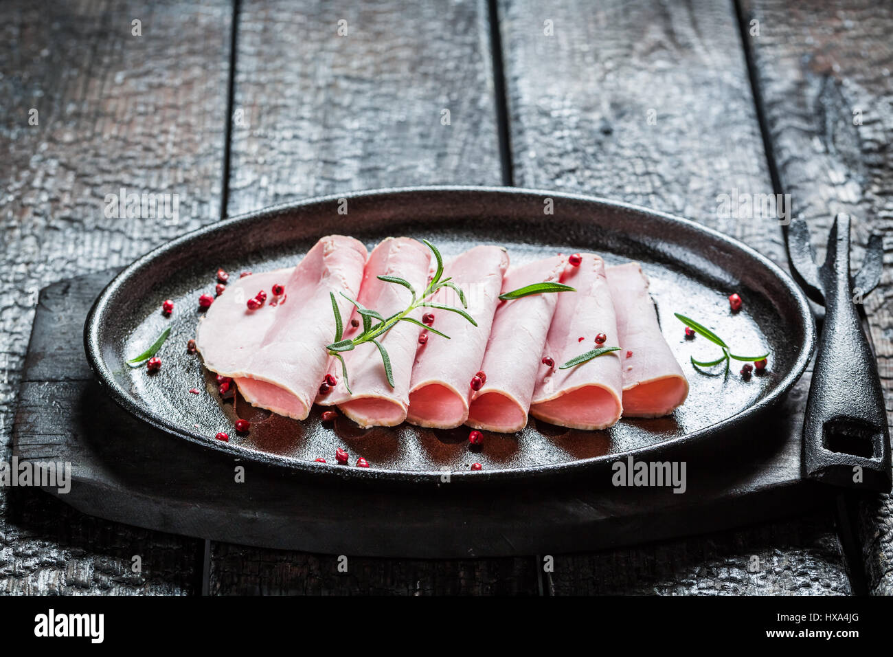 Fresh cold cuts on black buried board Stock Photo - Alamy
