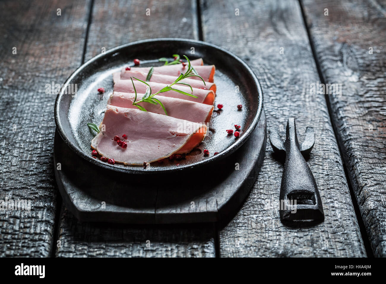 Tasty cold cuts on black buried board Stock Photo - Alamy