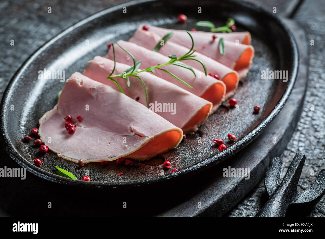 Smoked cold cuts on black buried board Stock Photo - Alamy