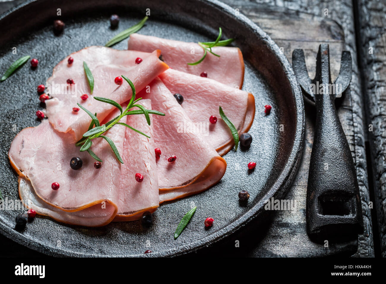 Tasty cold meats with pepper and herbs Stock Photo - Alamy