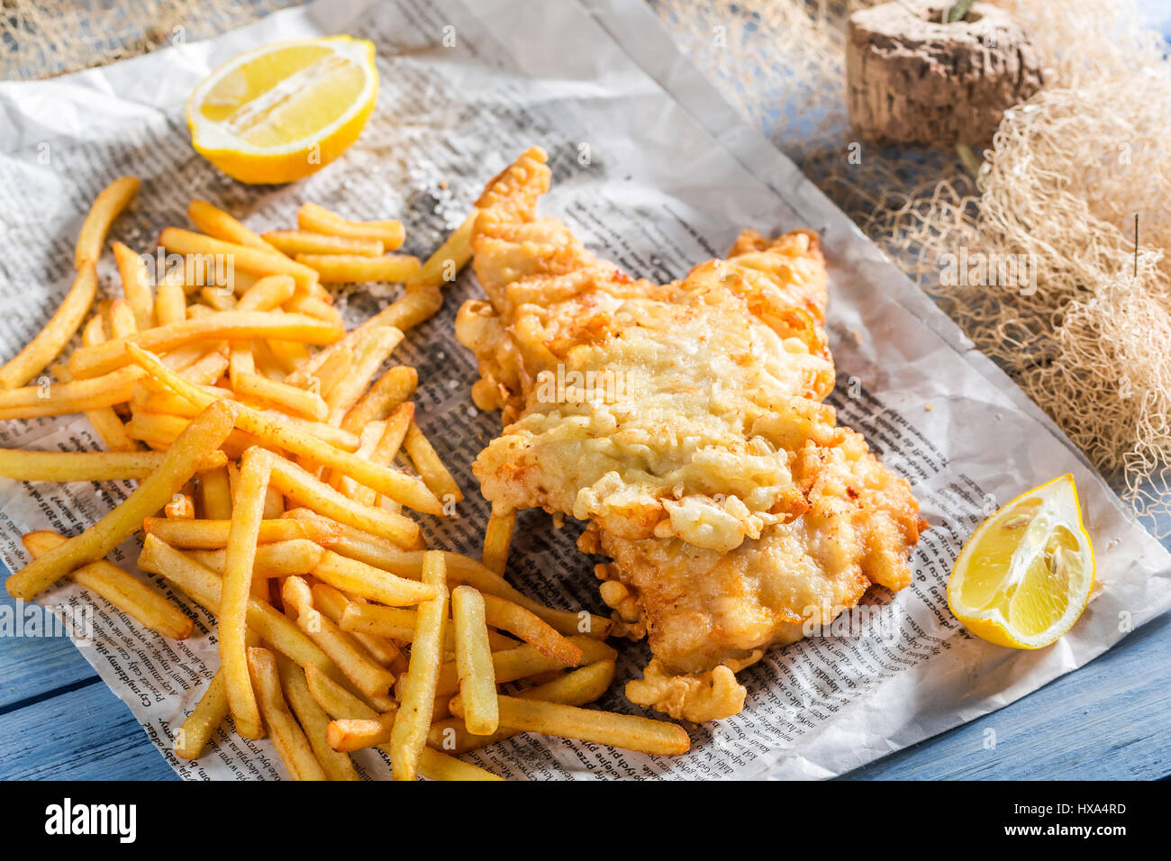 Tasty fish cod with chips served in paper Stock Photo - Alamy