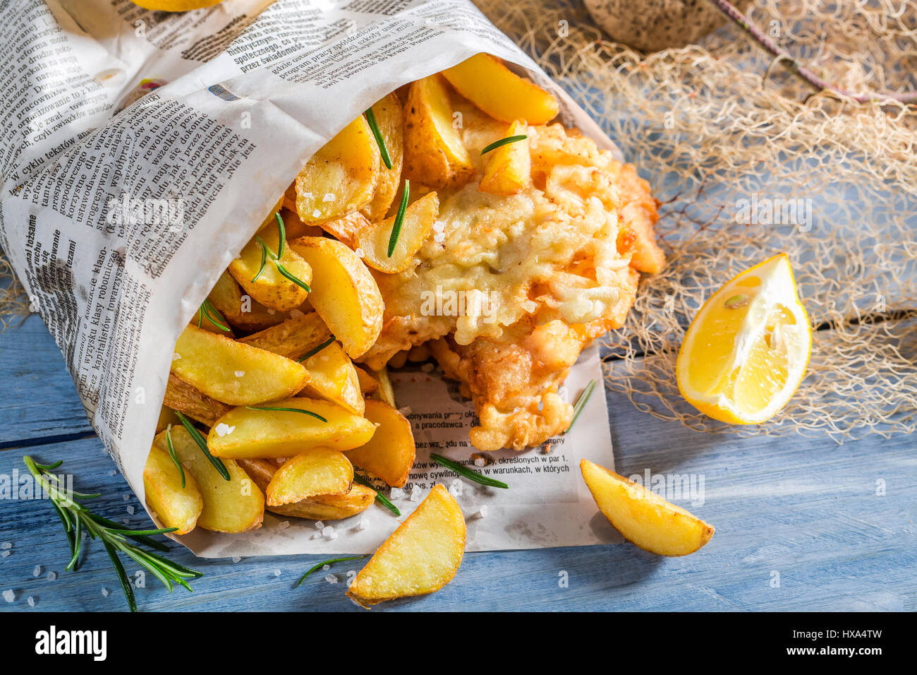 Delicious fish cod with chips with lemon Stock Photo - Alamy