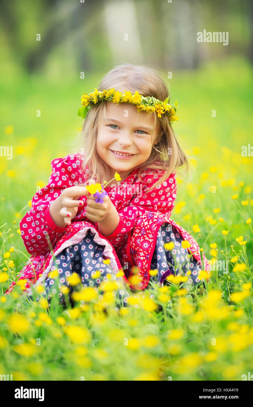 Little girl in spring park Stock Photo - Alamy