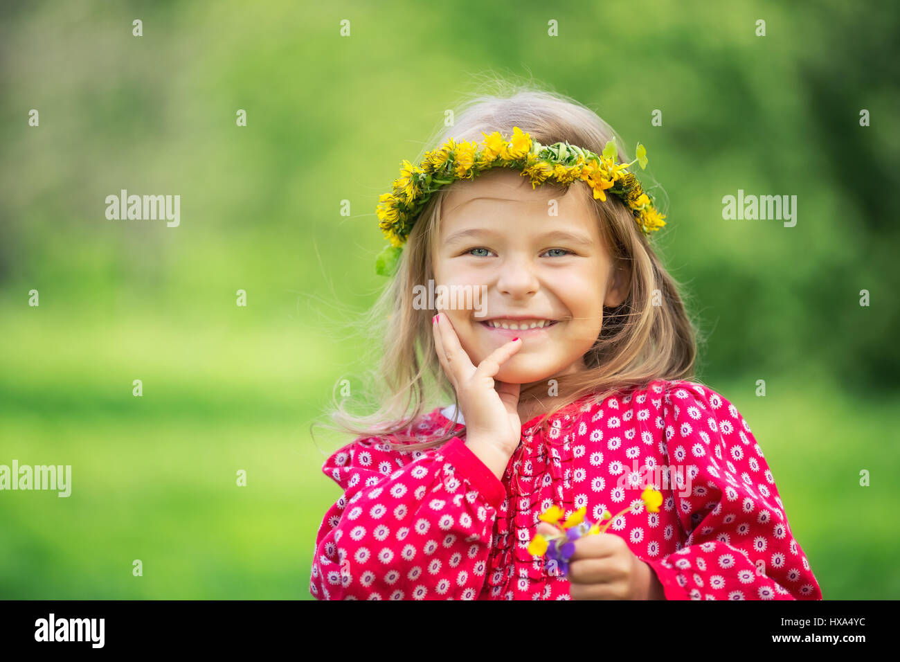 Little girl in spring park Stock Photo - Alamy