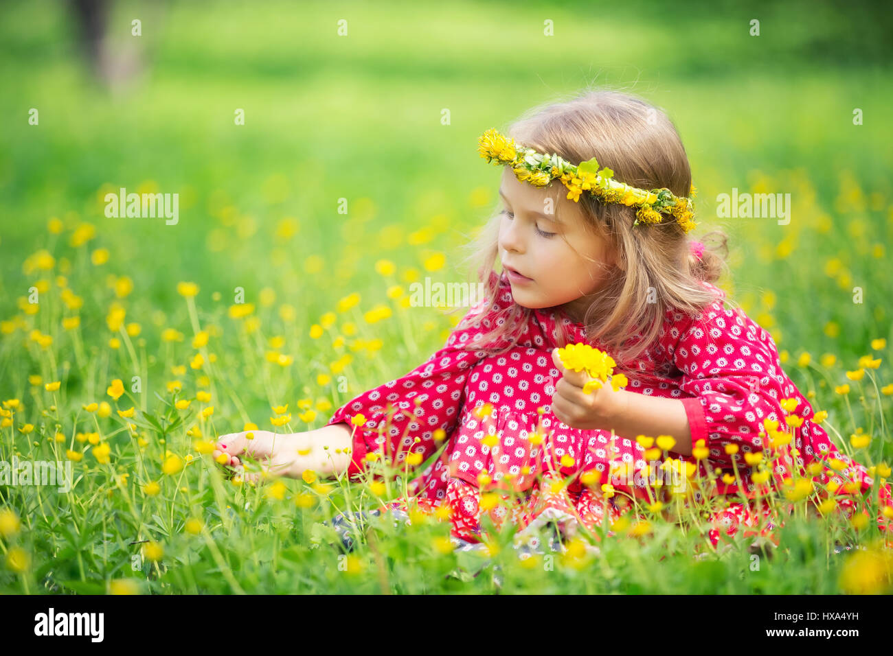 Little girl in spring park Stock Photo - Alamy