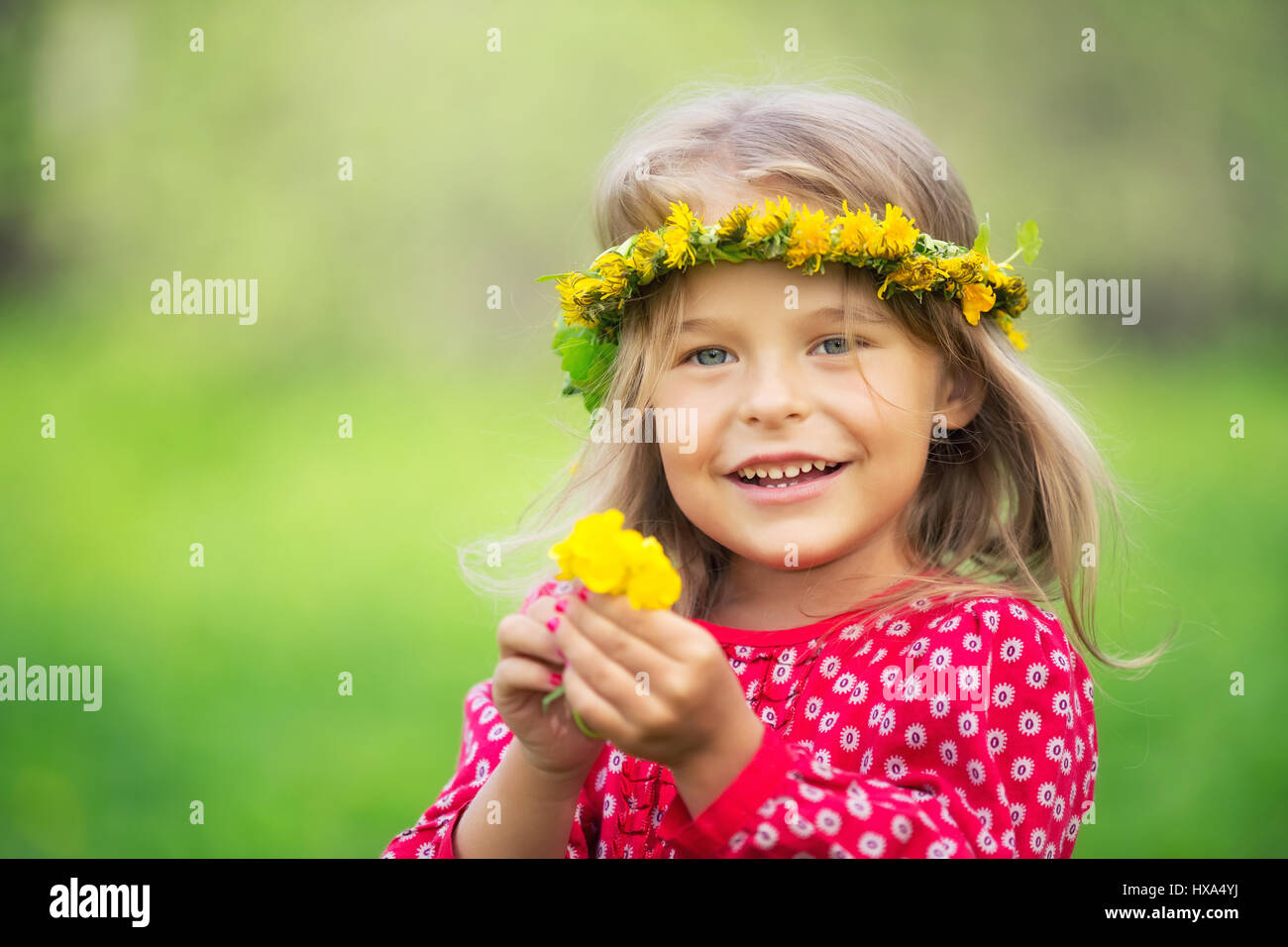 Little girl in spring park Stock Photo - Alamy