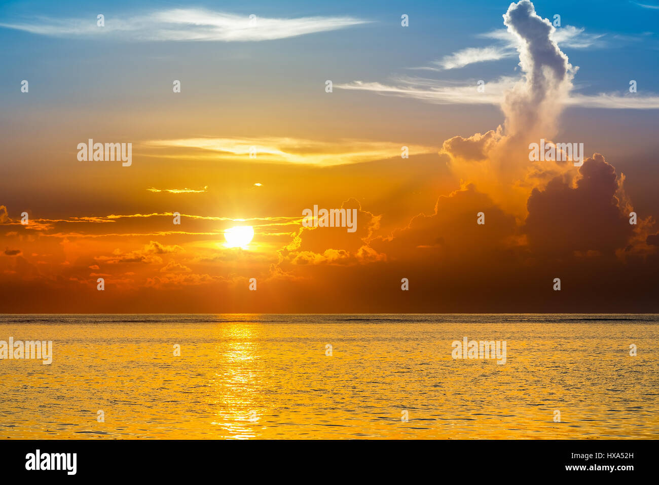 Bright sunset over ocean Stock Photo - Alamy