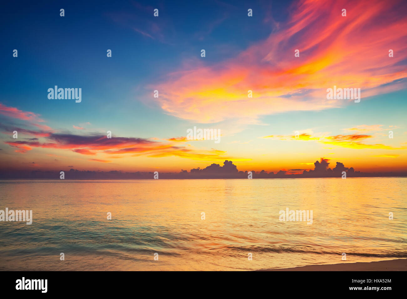 Sunset over ocean Stock Photo - Alamy