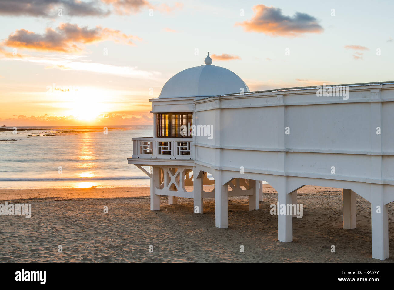 Romantic sunset at Cadiz beach with famous pier Stock Photo - Alamy
