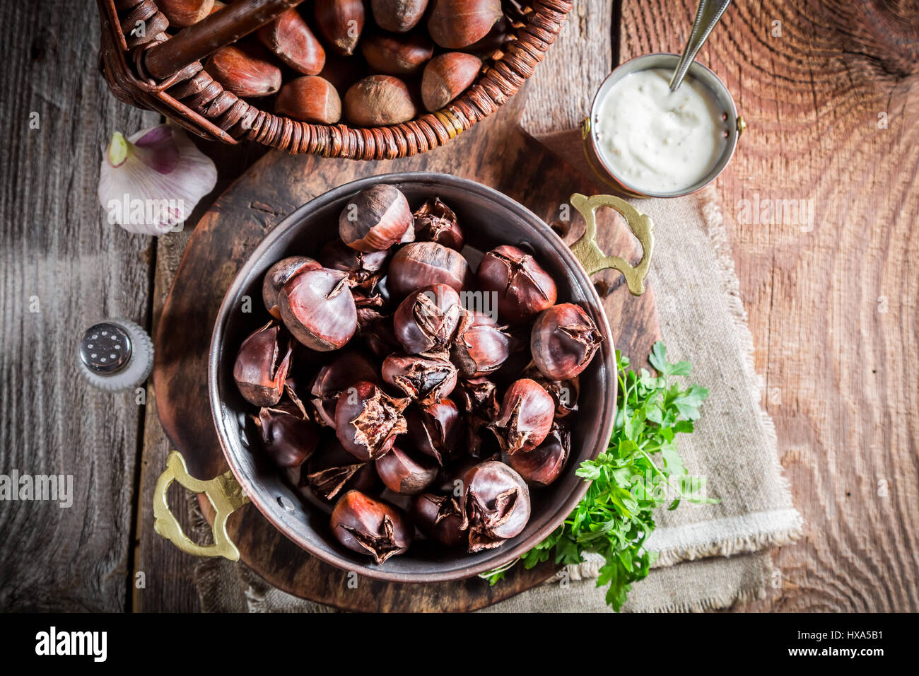 Closeup of fresh chestnuts with garlic sauce Stock Photo - Alamy