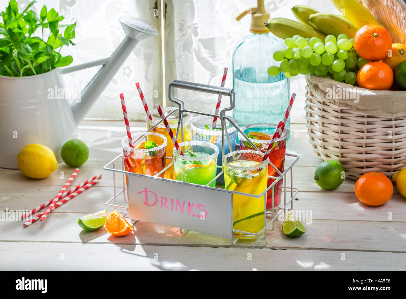 Sweet drink with citrus fruits on old white table Stock Photo - Alamy