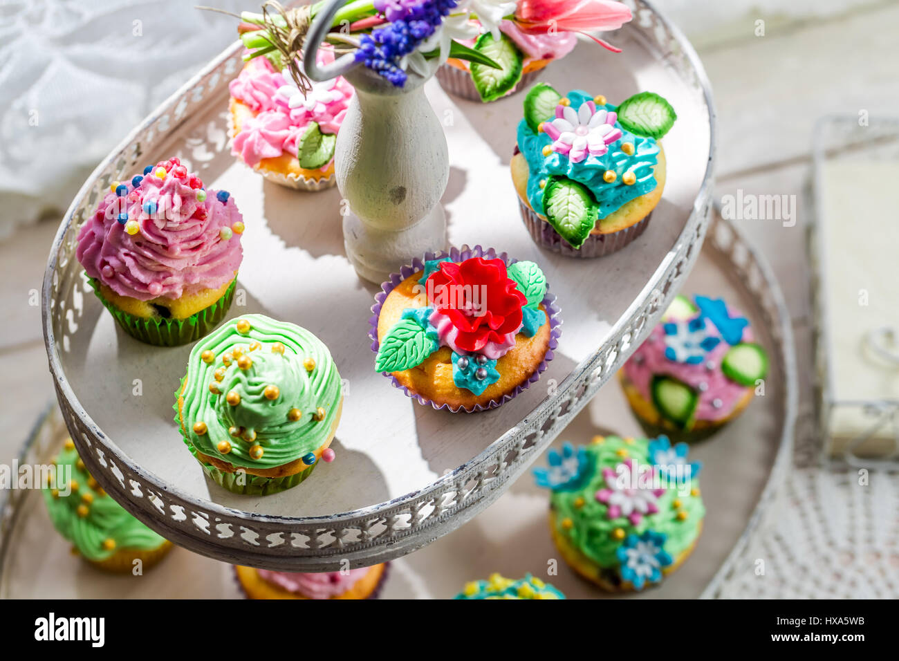 Sweet muffins with sweet decoration and cream Stock Photo - Alamy