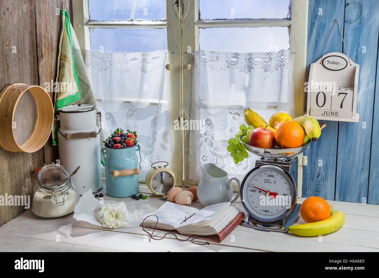 Preparations for baking homemade donuts on old white table Stock Photo ...