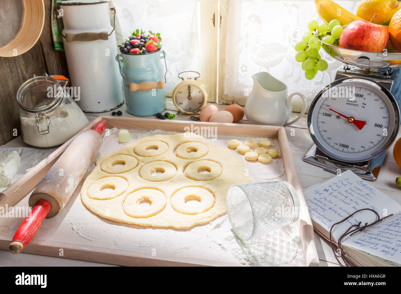 Baking sweet donuts in the rustic kitchen Stock Photo - Alamy