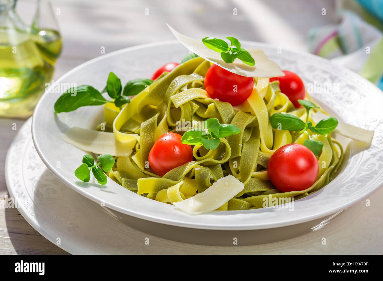 Tasty tagliatelle in the sunny kitchen on old white table Stock Photo ...
