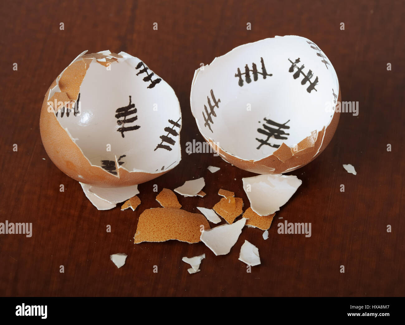 Broken egg shell closeup on dark background Stock Photo - Alamy
